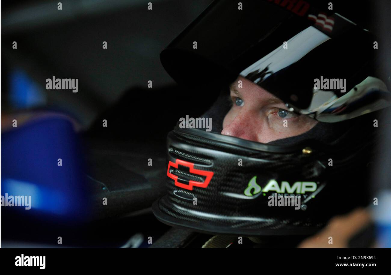 Dale Earnhardt Jr., sits in his car during NASCAR auto racing practice ...