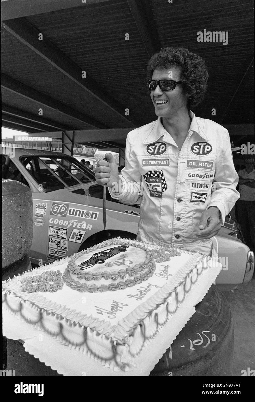 In a rather unorthodox style, Richard Petty plunges a butcher knife ...