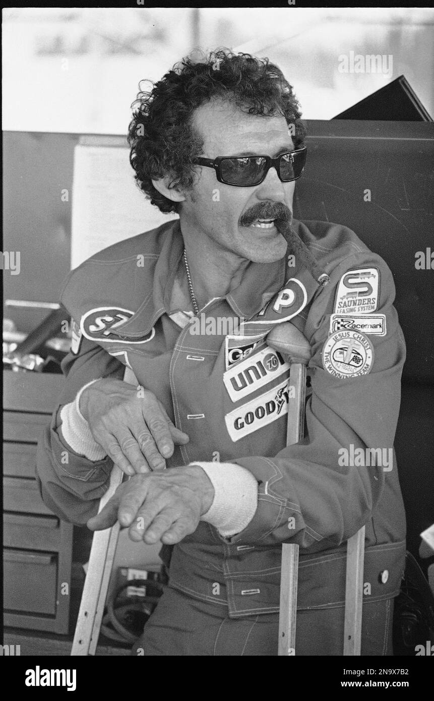 Richard Petty leans on a set of crutches during qualifying at Atlanta ...
