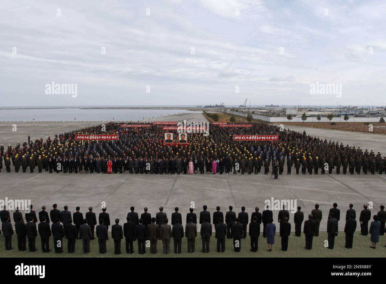 In this photo taken Thursday, May 3, 2012, construction workers and ...