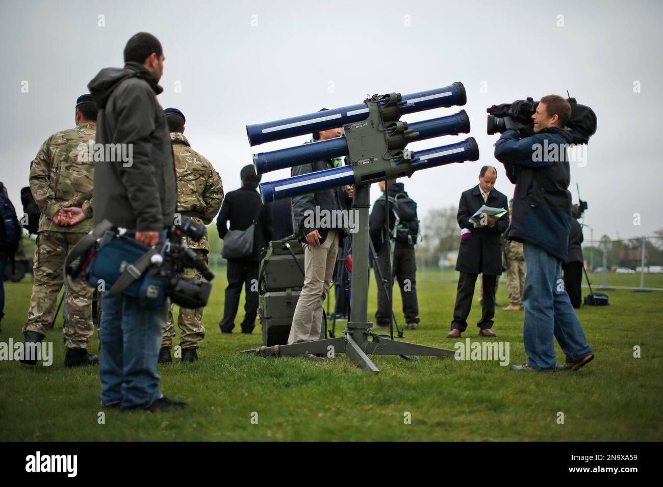 A cameraman films an HVM lightweight multiple launcher during a media ...