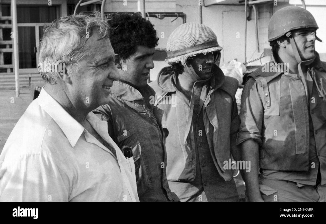 Israeli Defence Minister Ariel Sharon and three Isareli soldiers gaze ...