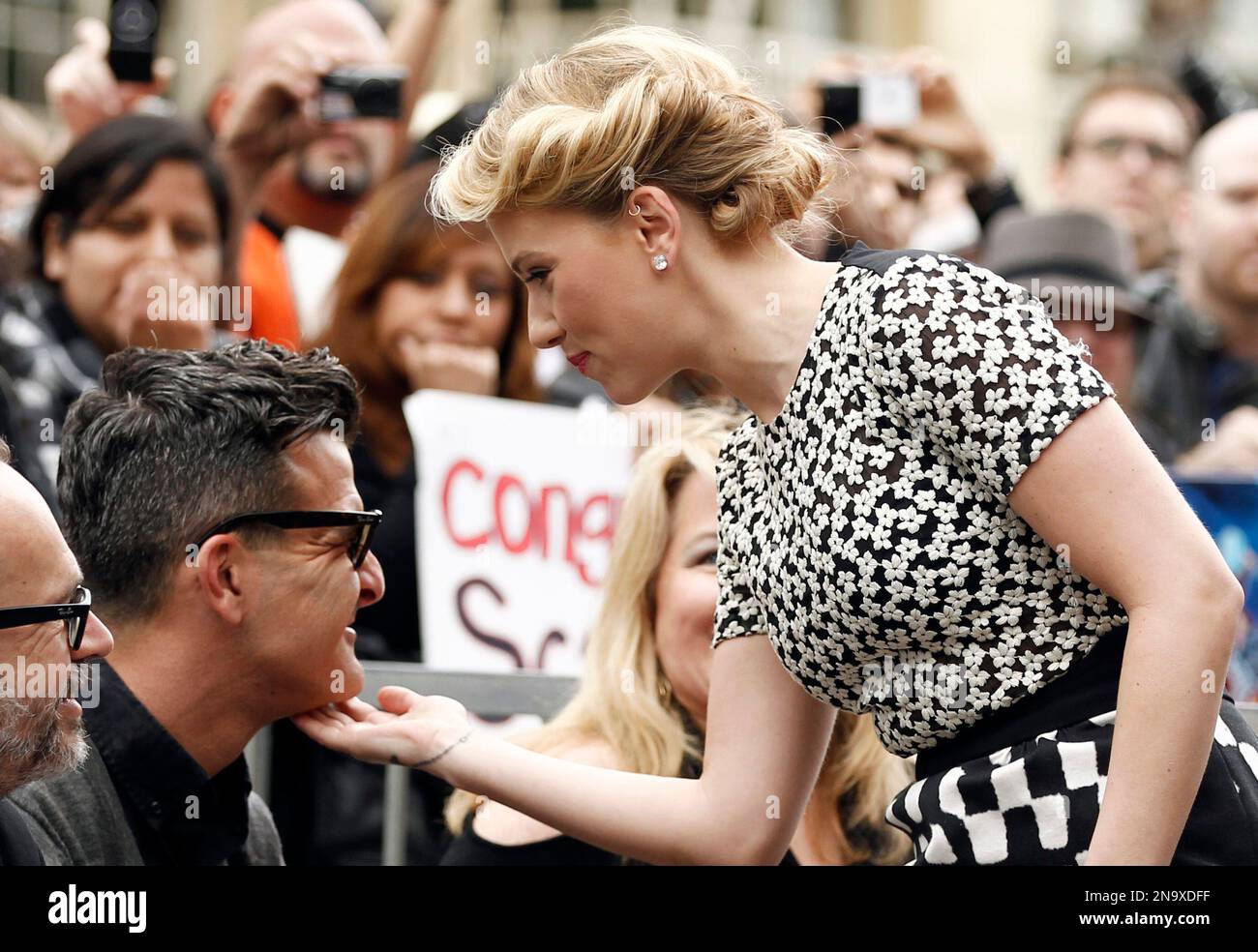 Actress Scarlett Johansson, right, greets Nate Naylor before receiving ...