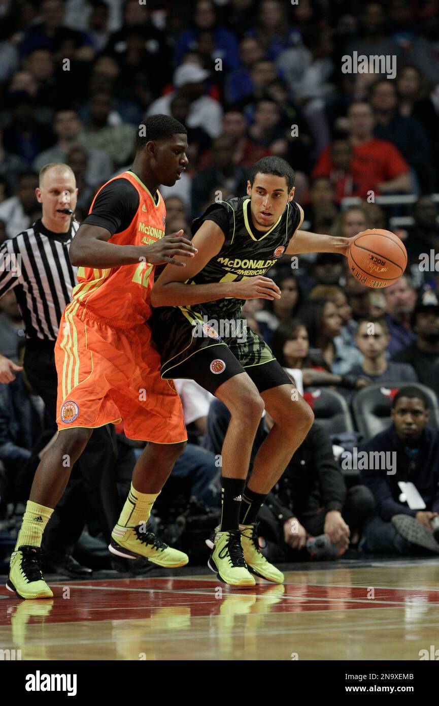 McDonald's West All-American Grant Jerrett (11) pushes past East All ...