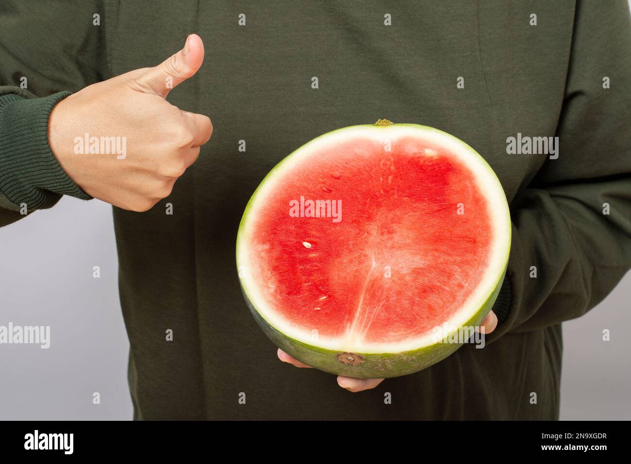 Hand holding fresh watermelon slice hi-res stock photography and images ...