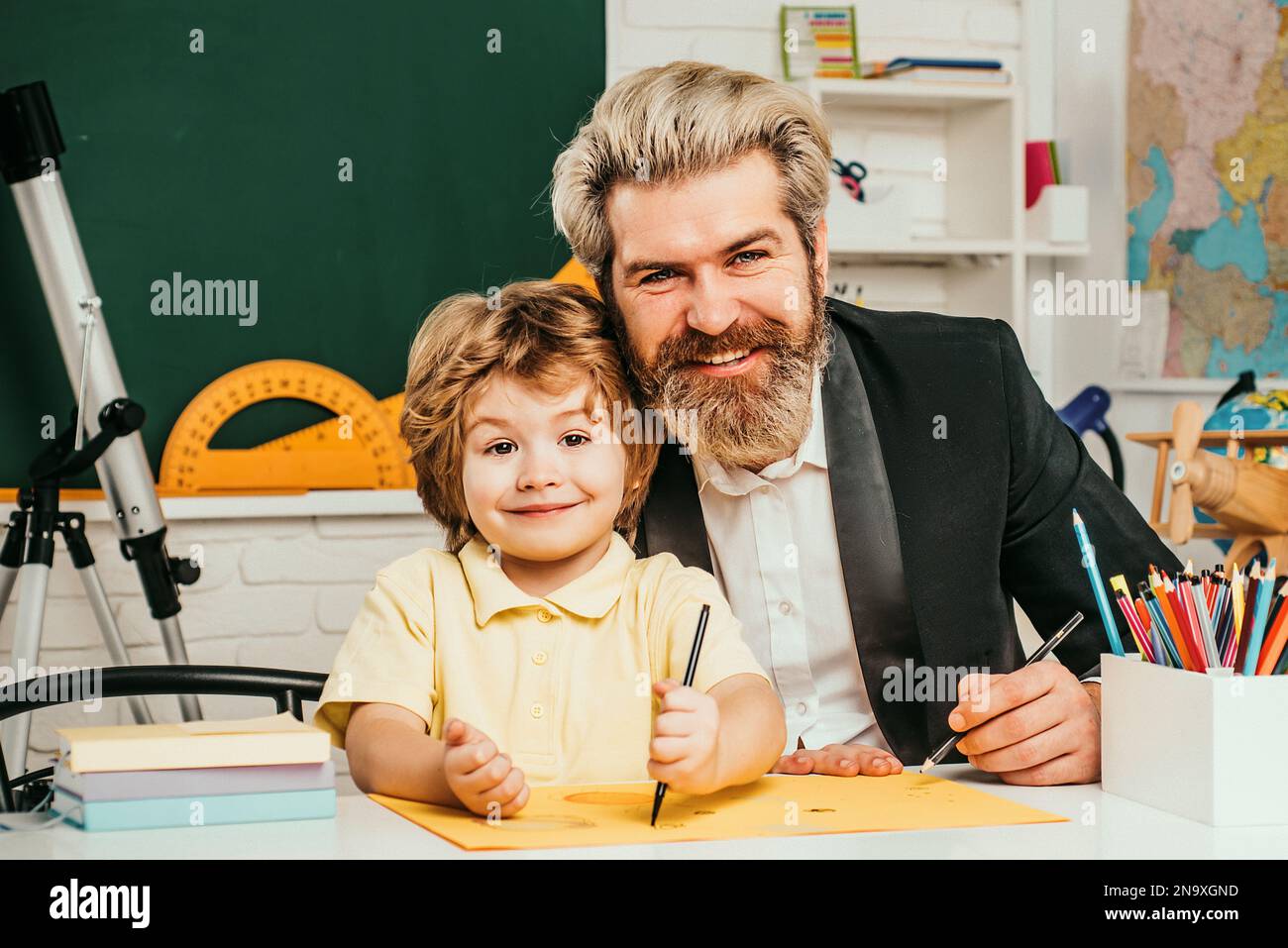 Young happy family father and son schooling math together. Education ...