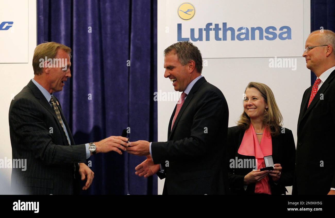 Boeing senior vice president Pat Shanahan, left, hands over the keys to ...