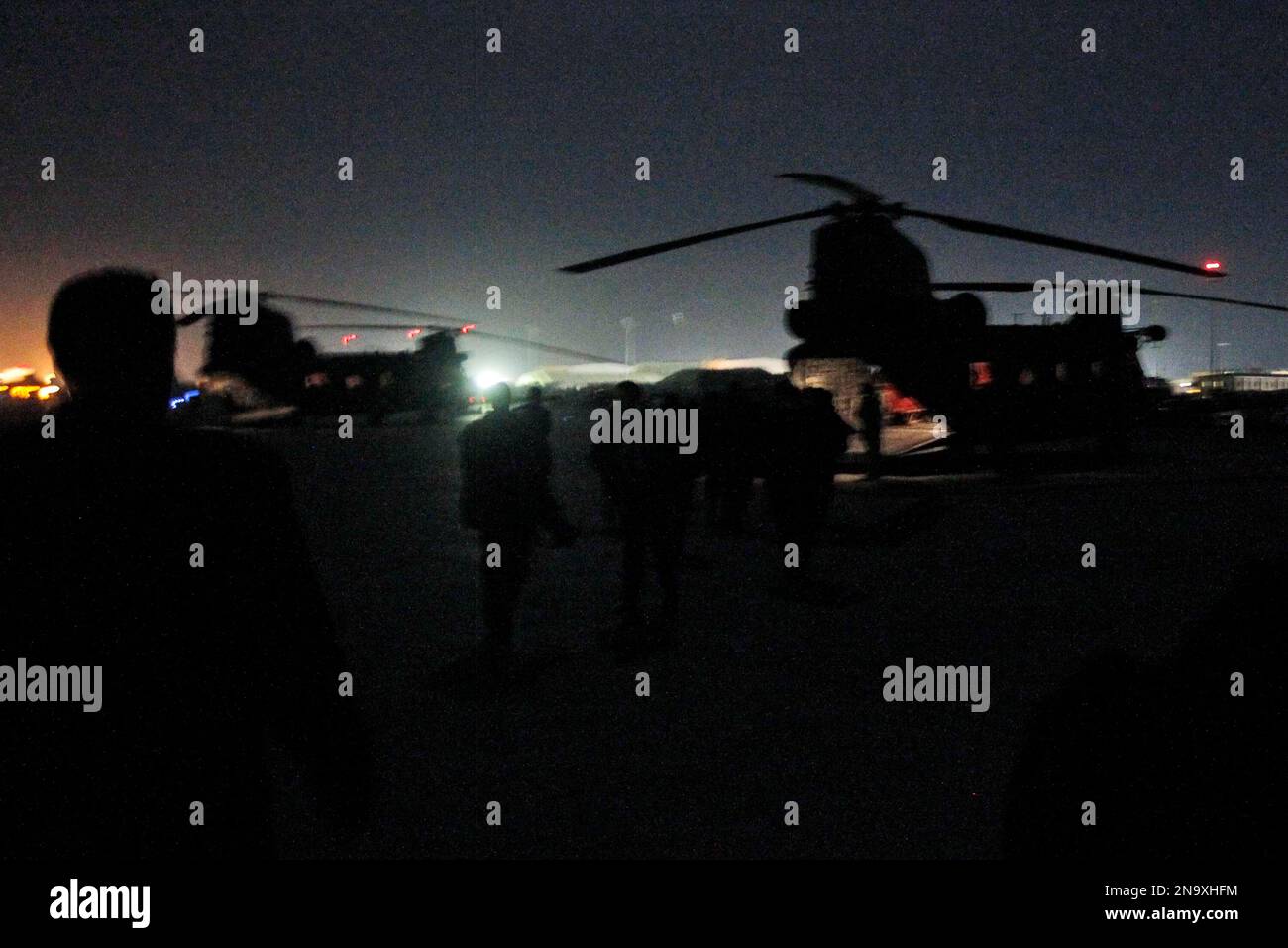 Arriving in darkness, members of the press and the President Barack ...