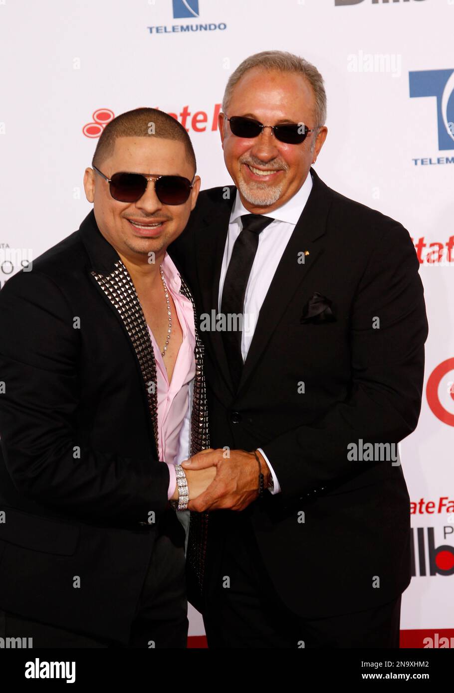 Singer Larry Hernandez with music producer Emilio Estefan walk the red ...
