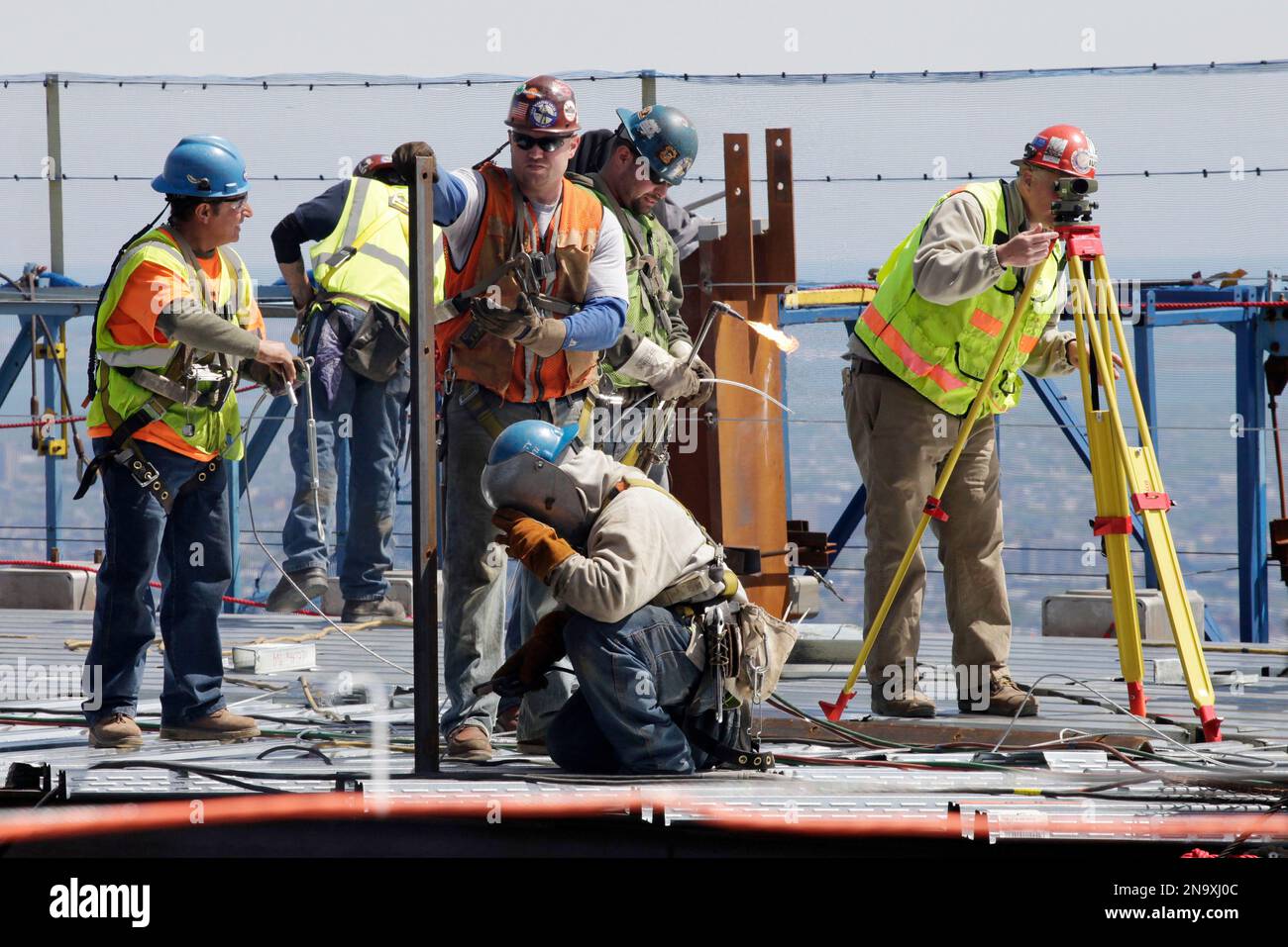 Ironworkers weld steel decking at the top of One World Trade Center on ...