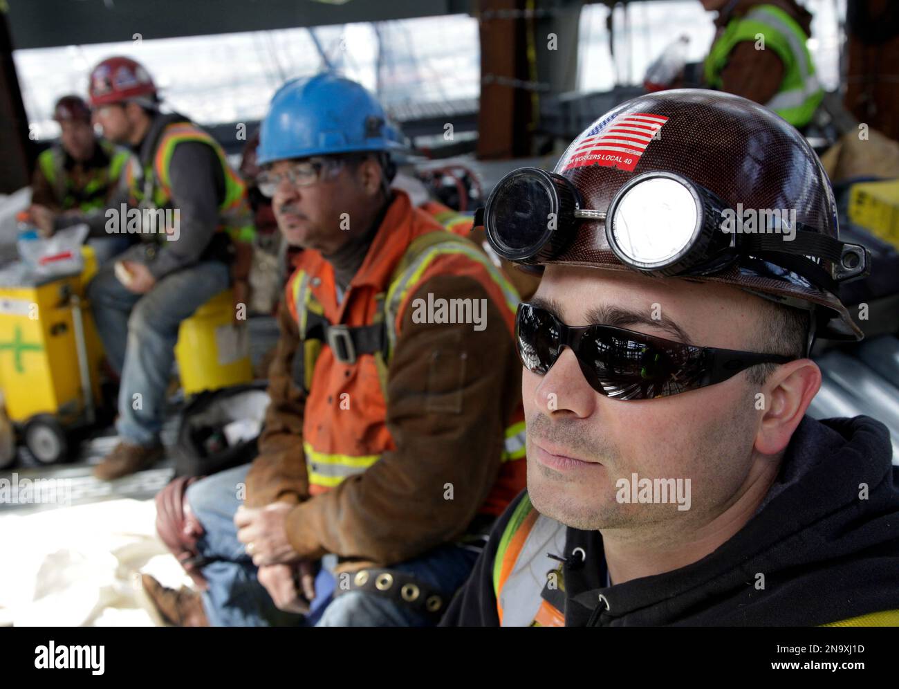 Ironworkers take a break at One World Trade Center on the day it became ...