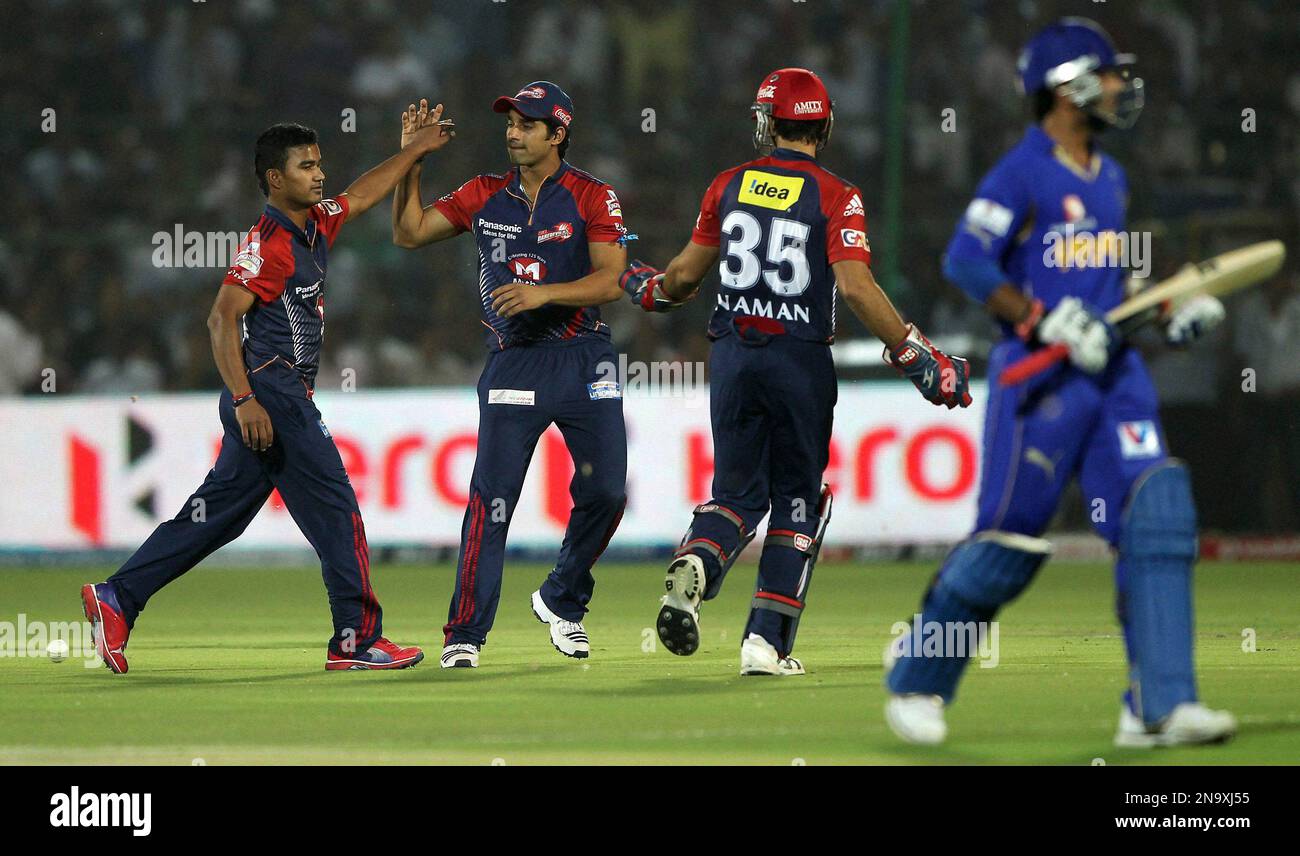 Delhi Daredevils Pawan Negi, left, celebrates the dismissal of ...