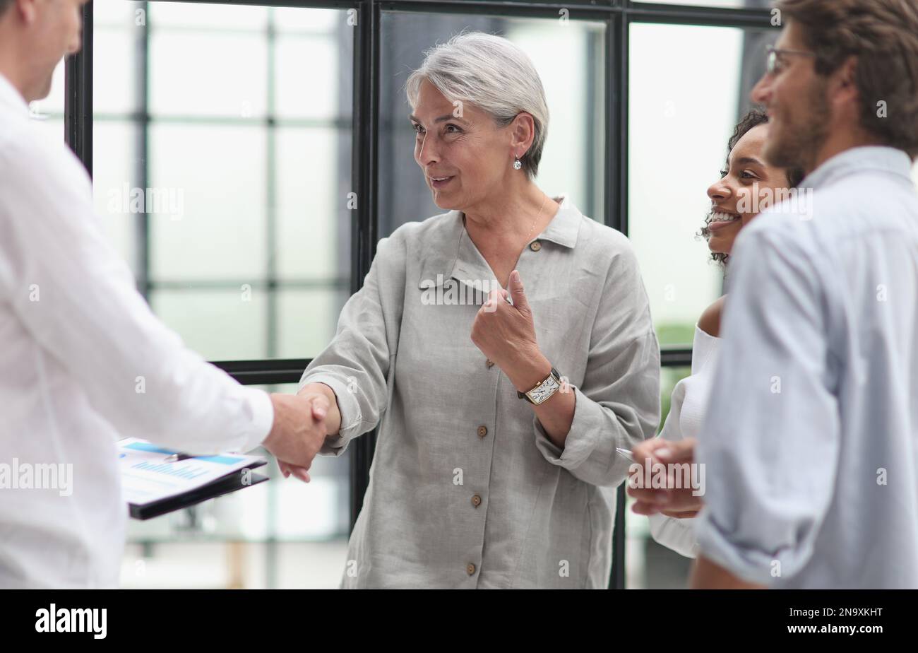 Conversation between managers and employees in the office Stock Photo ...