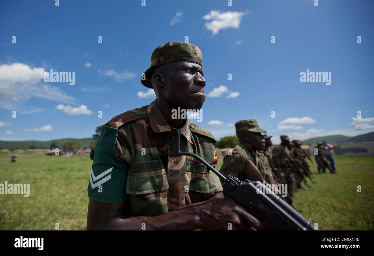 Soldiers from the Uganda People's Defence Force (UPDF) engage in ...