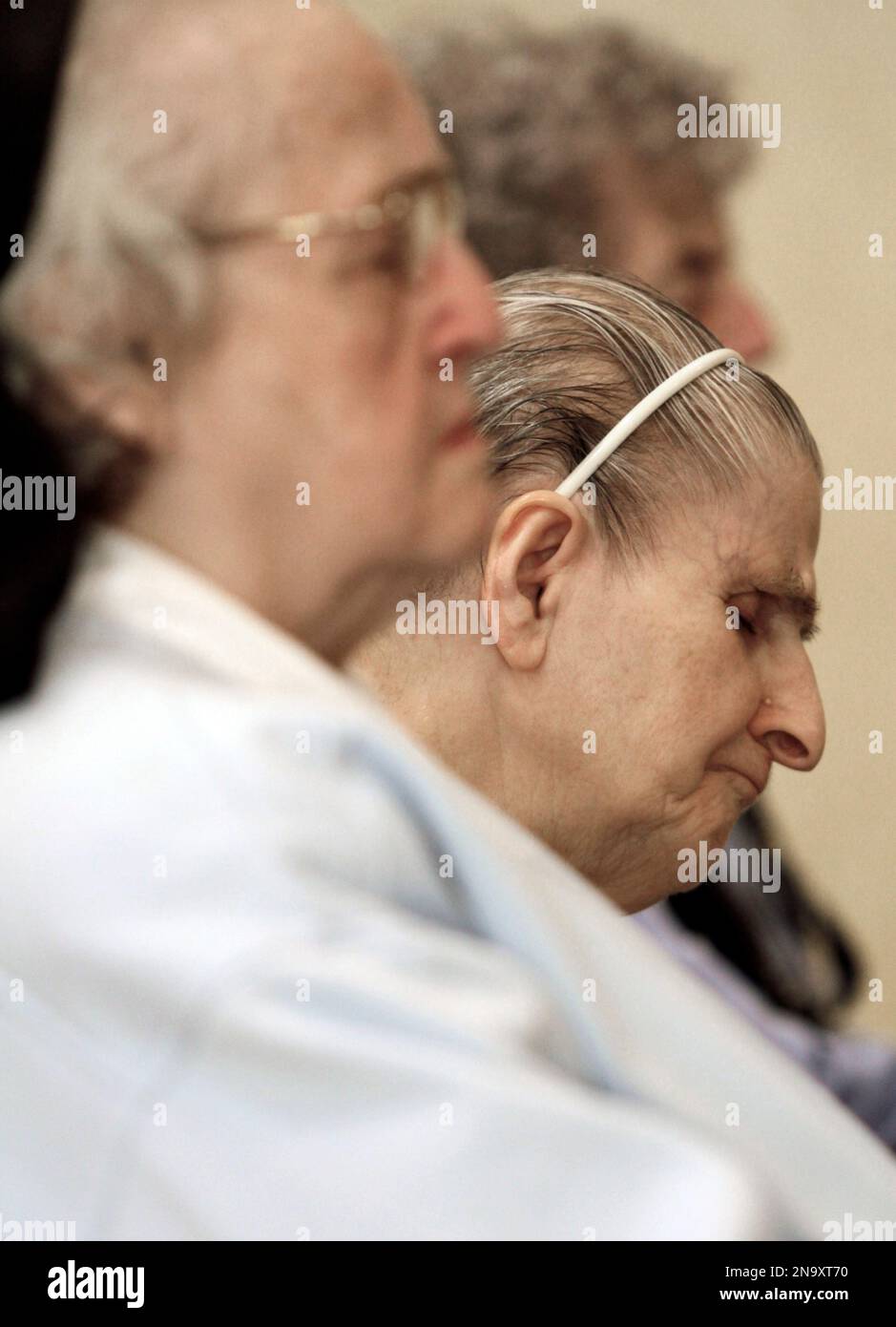 In this April 10, 2012, photo, sister Theresa LaBrecque, center, prays ...