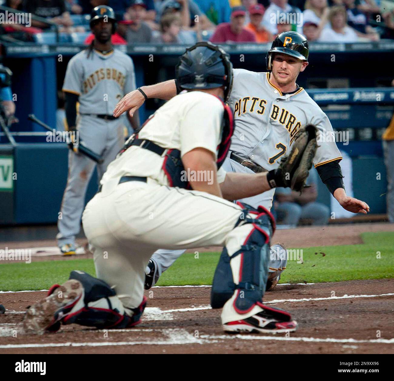 Pittsburgh Pirates' Alex Presley prepares to slide safely into home to ...