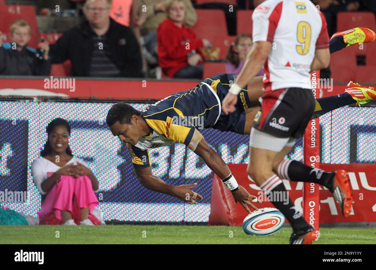 Australia's Brumbies Henry Speight, left, scores a try during their ...