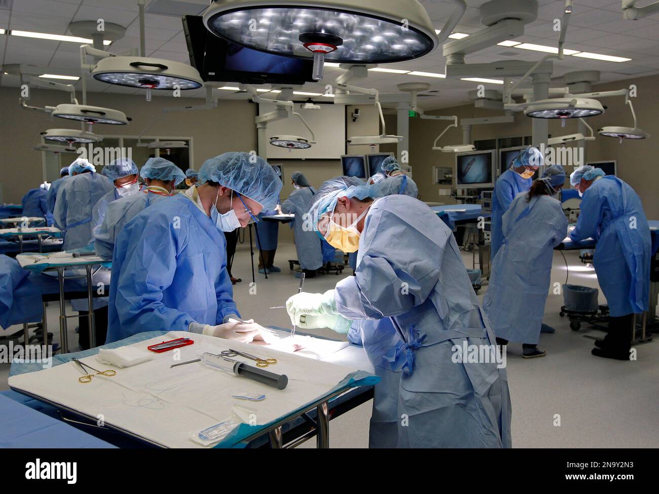 In this April 19, 2012, photo, students work in the operating rooms at ...