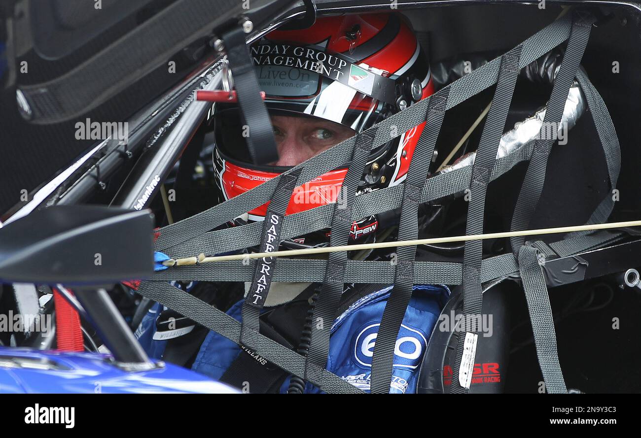 Driver John Pew waits his turn to drive the Michael Spank Racing team ...