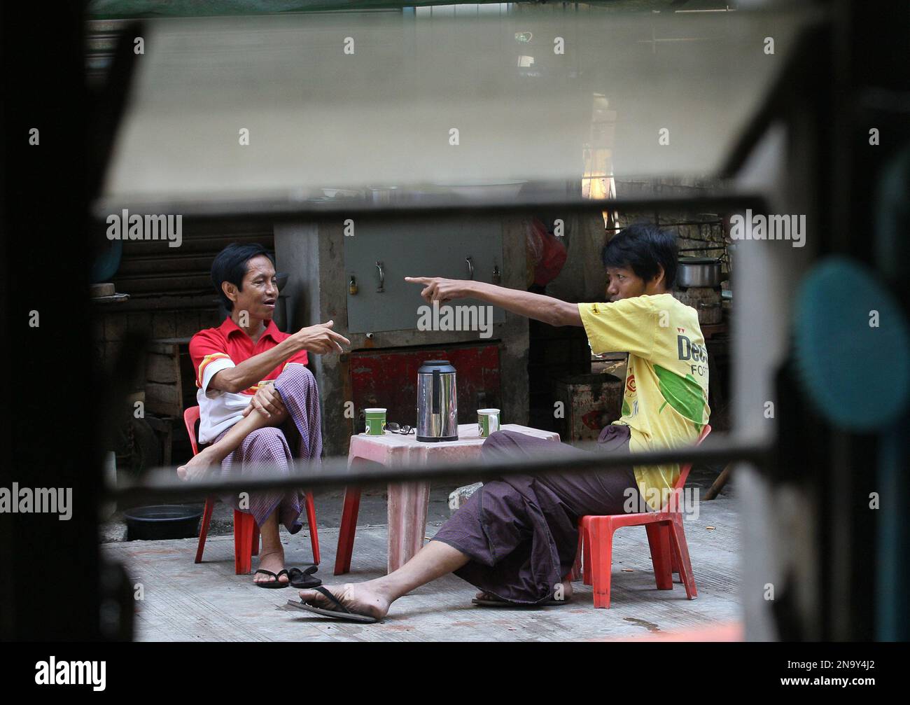 A Myanmar residents talk at a tea shop in Yangon, Myanmar Friday April ...