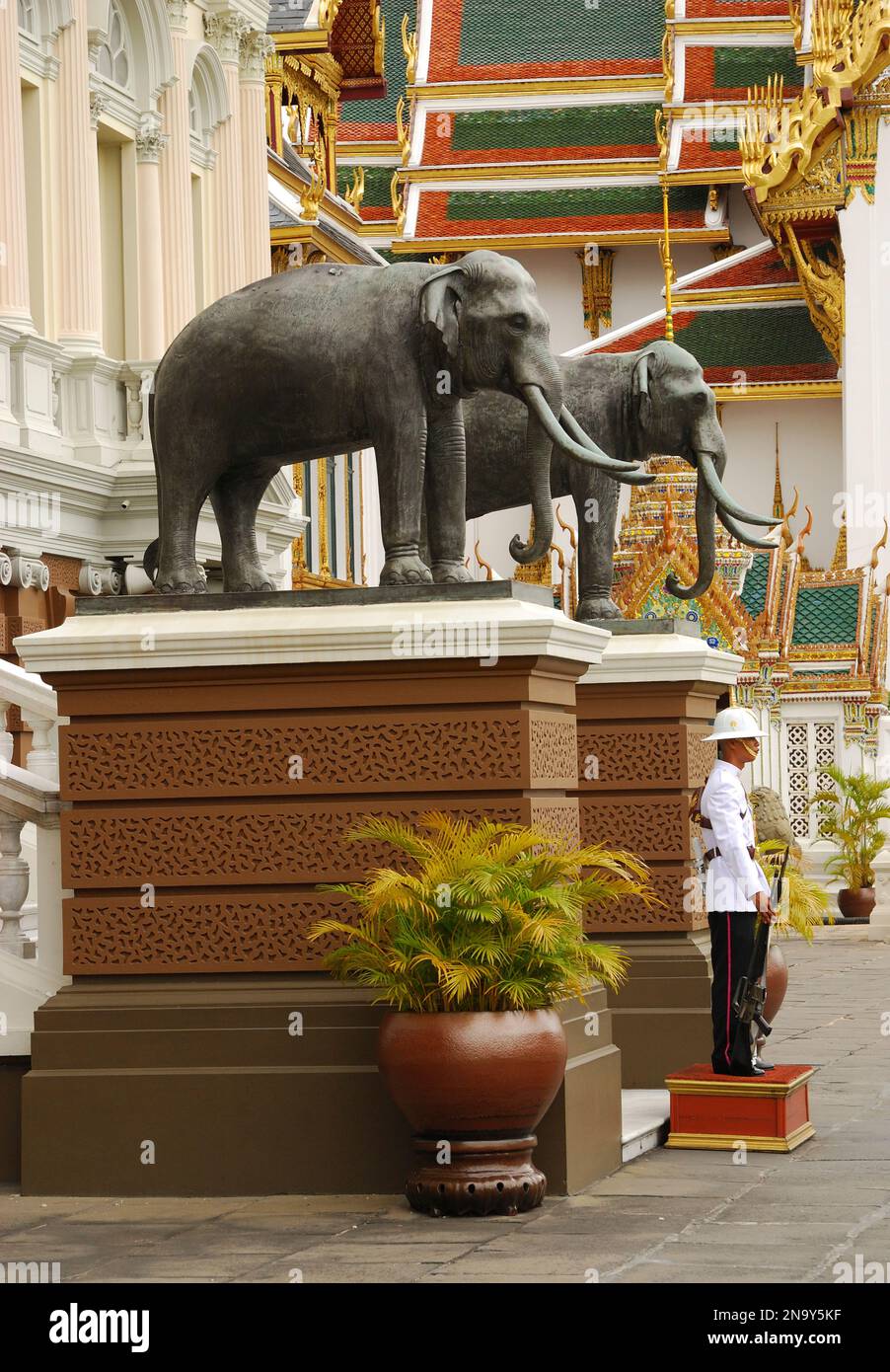 A soldier of the King's Guard and elephant statues in front of the ...