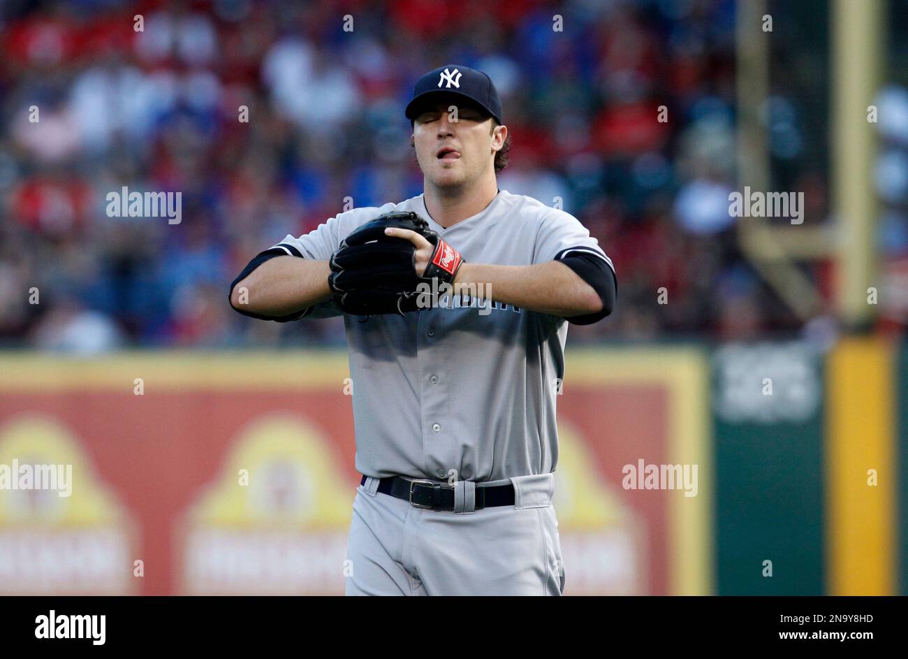 New York Yankees starting pitcher Phil Hughes (65) between pitches to ...