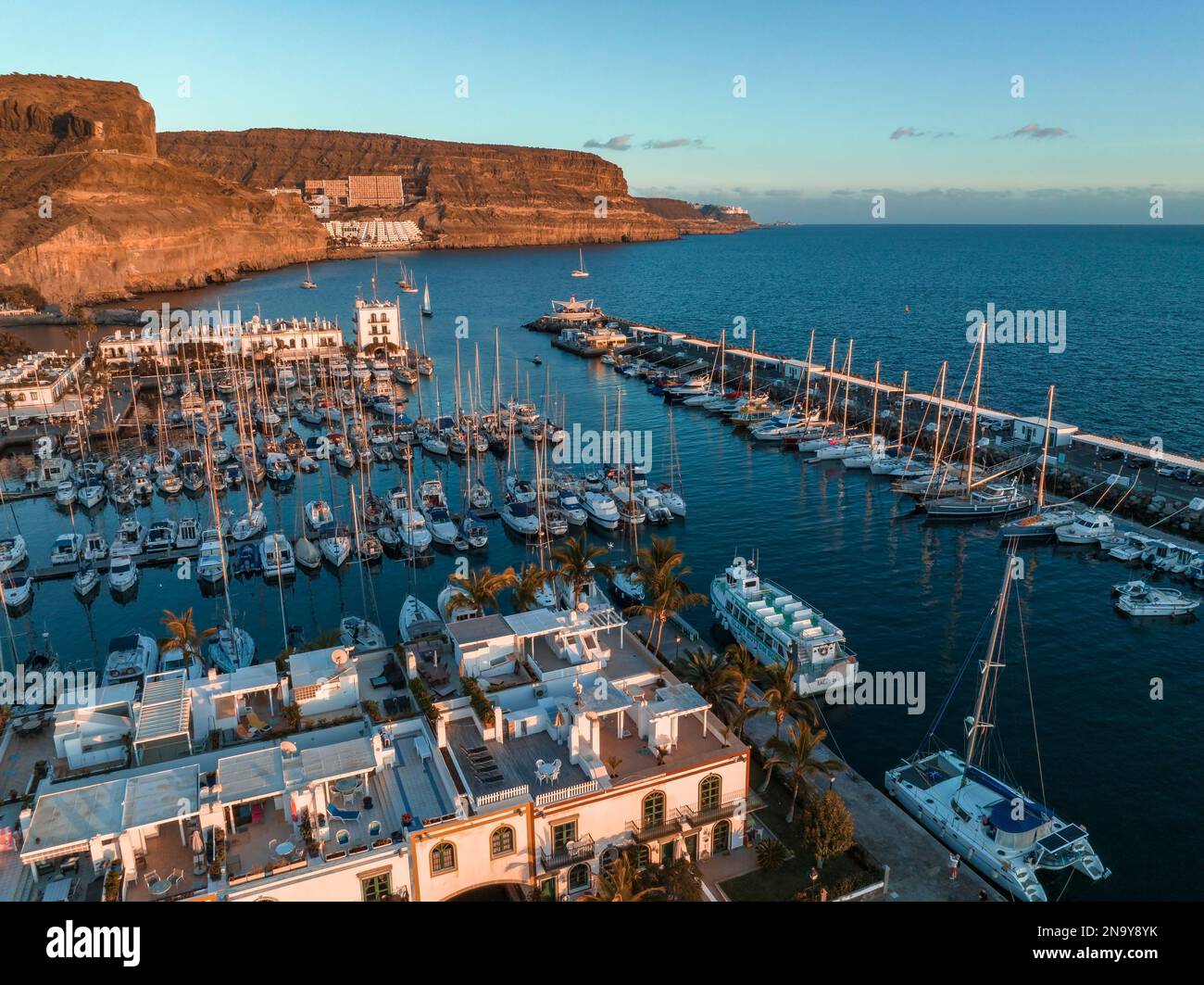 Puerto de Mogan fishing town aerial view at sunset Stock Photo - Alamy