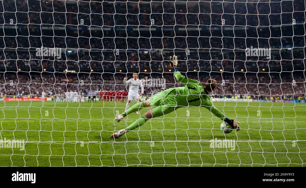 Bayern Munich goalkeeper Manuel Neuer saves a penalty kick on his way ...