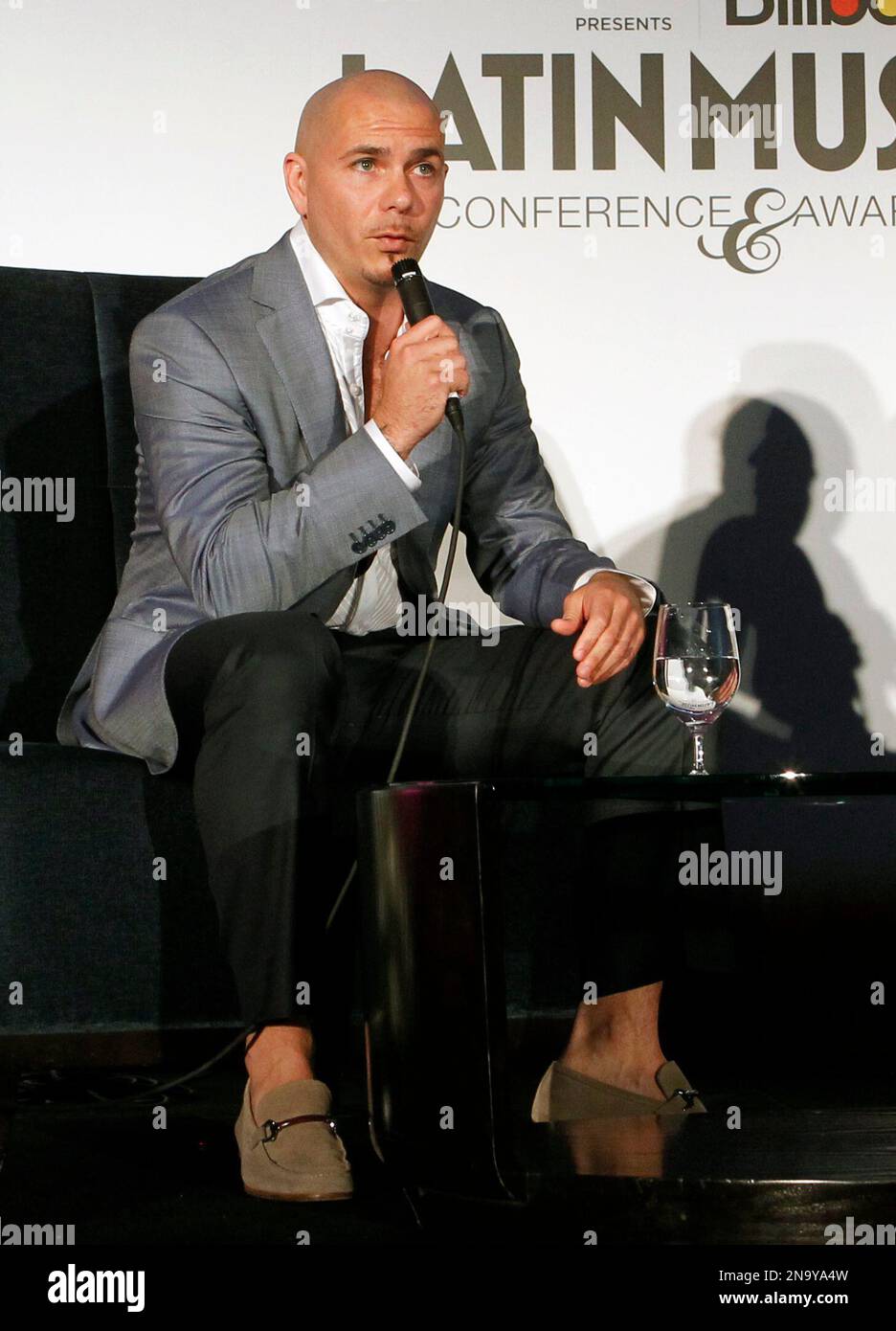 Miami rapper Pitbull talks to a reporter in Miami, Wednesday, April 25 ...