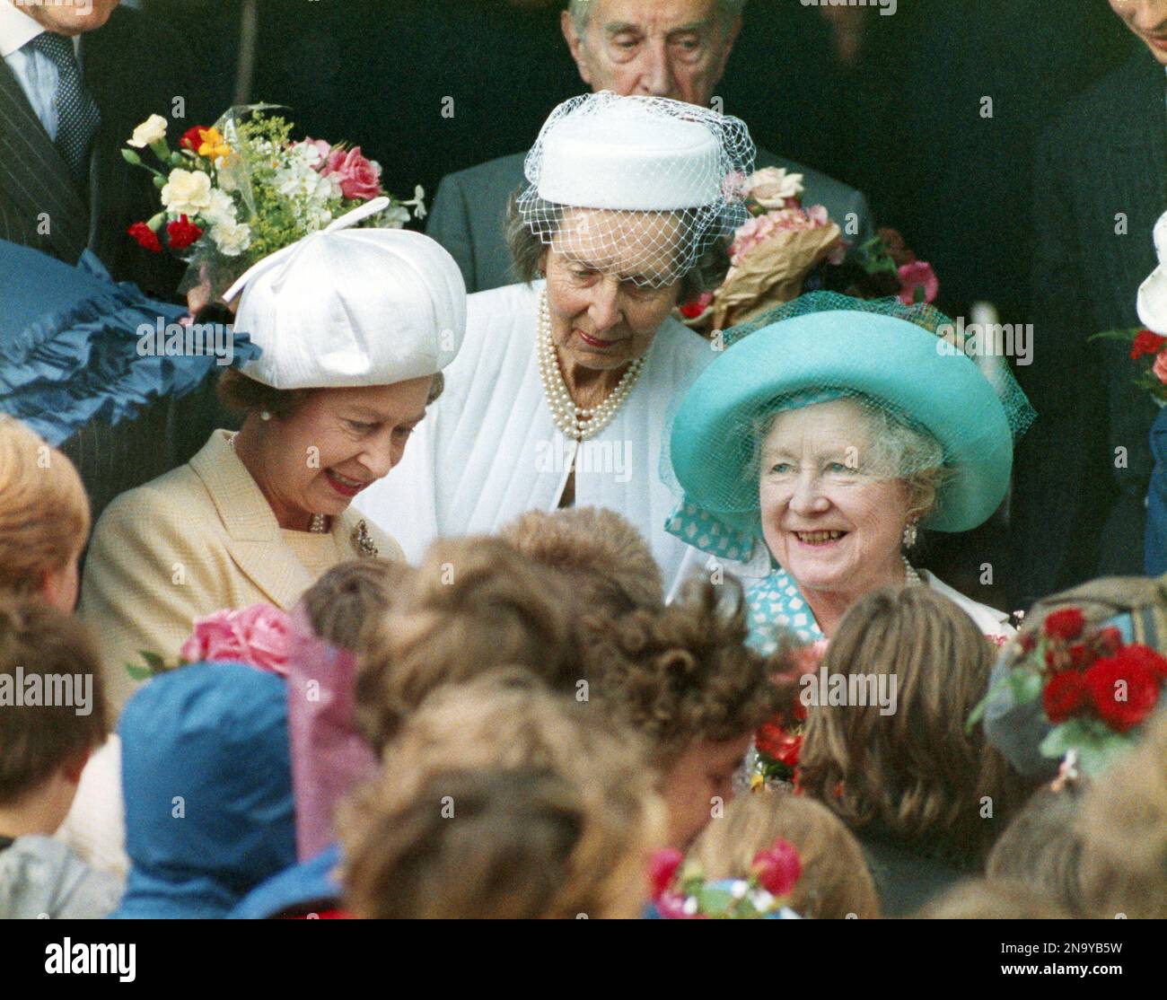 Surrounded by well-wishers, Queen Elizabeth, the Queen Mother, on her ...