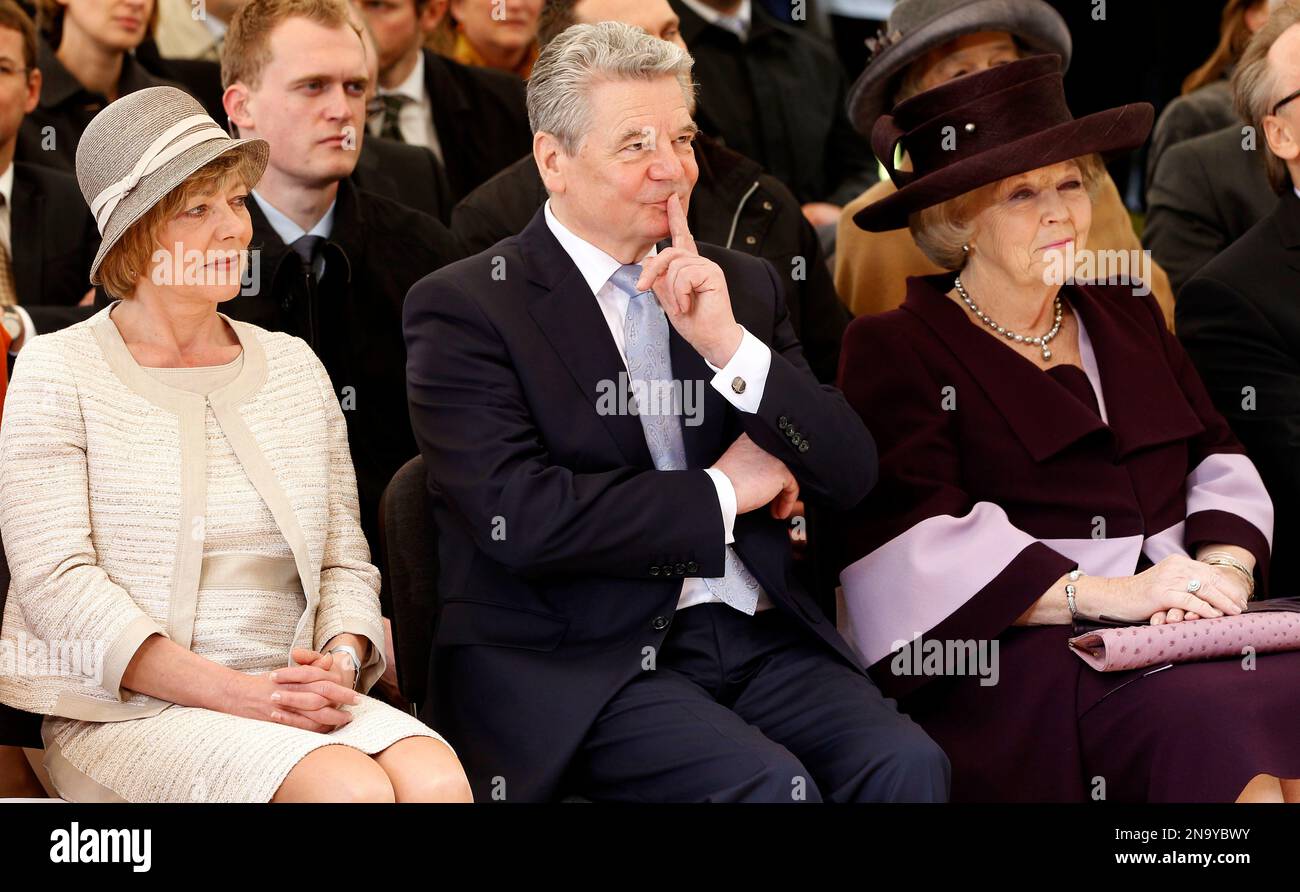 German President Joachim Gauck, center, Dutch Queen Beatrix, right, and ...
