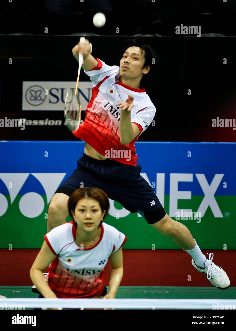 Japan's Shintaro Ikeda smashes as he pairs up with Reiko Shiota during ...