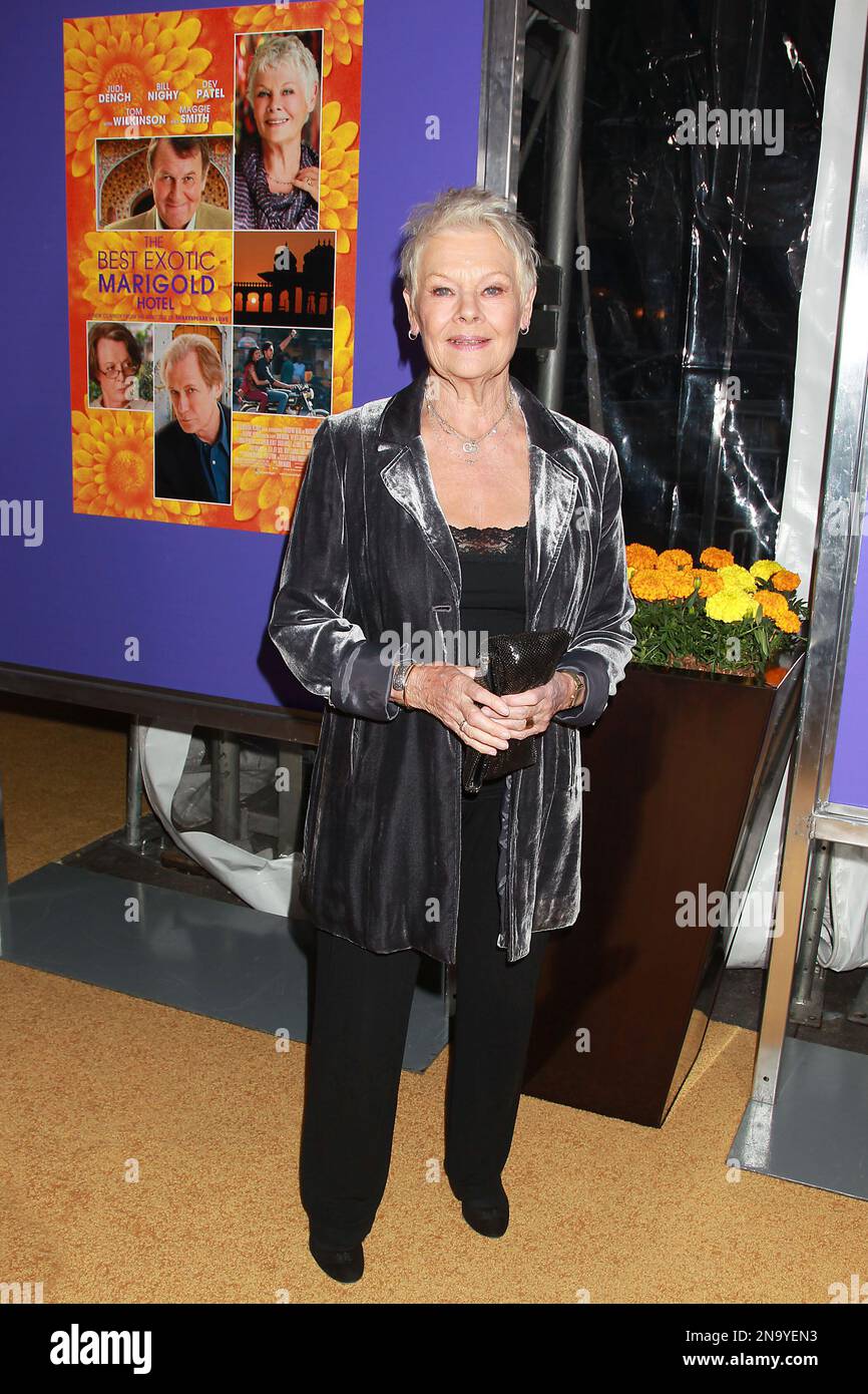 In this April 23, 2012 photo, actress Judi Dench arrives at the ...