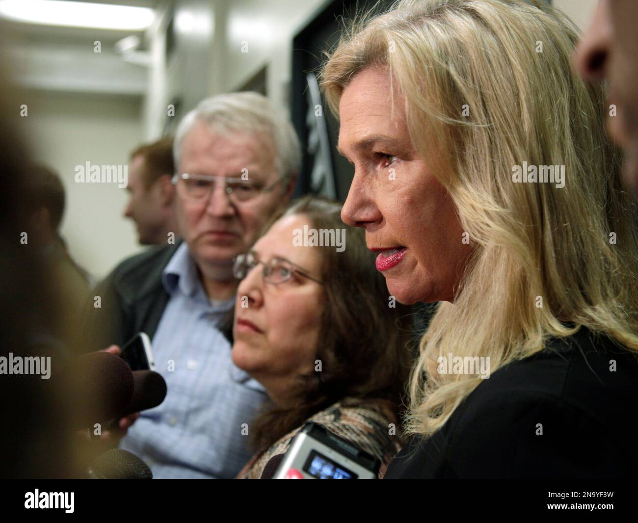Chuck and Judy Cox, left, look on as their attorney, Anne Bremner ...