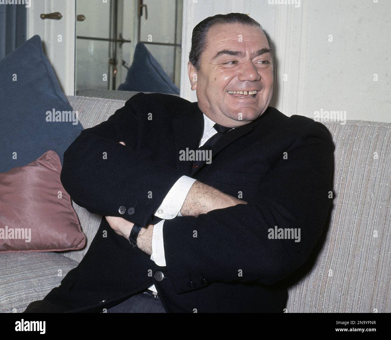American actor Ernest Borgnine gestures during an interview at his ...