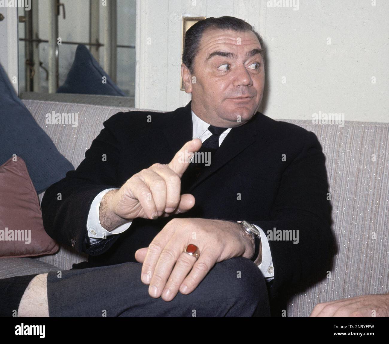 American actor Ernest Borgnine gestures during an interview at his ...