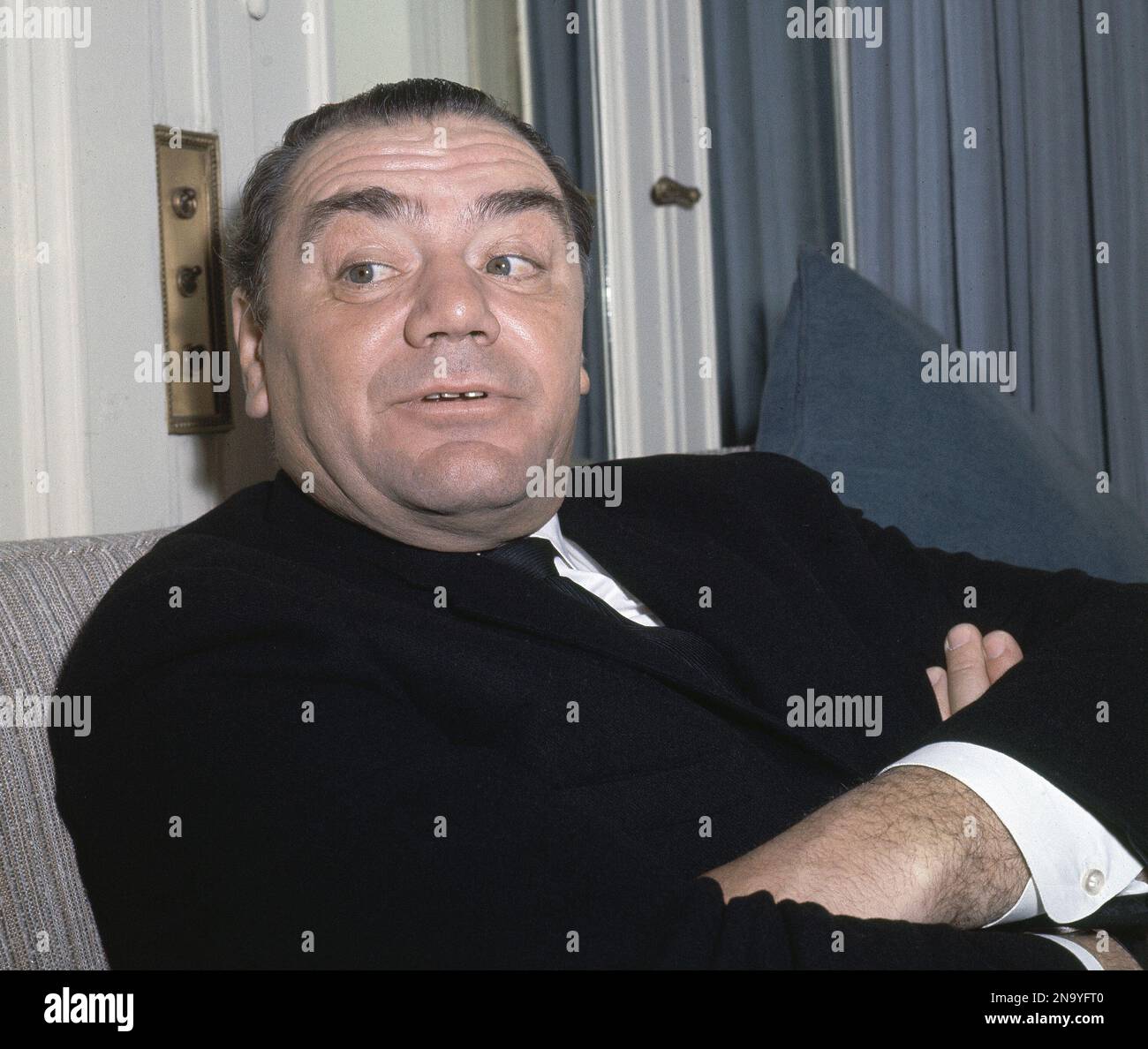 American actor Ernest Borgnine gestures during an interview at his ...
