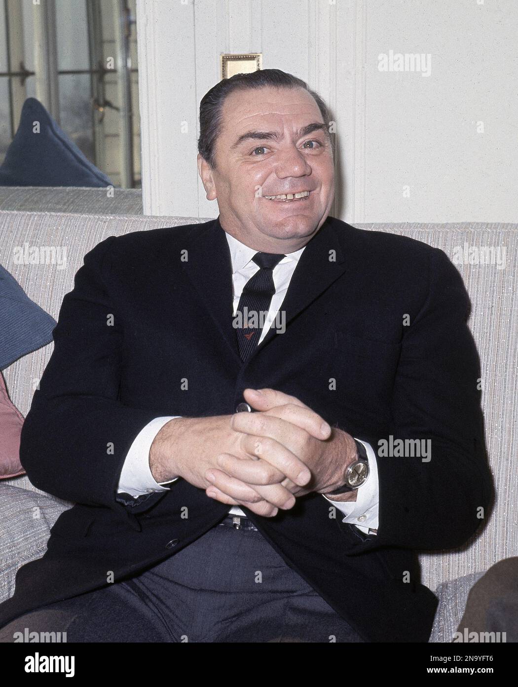 American actor Ernest Borgnine gestures during an interview at his ...