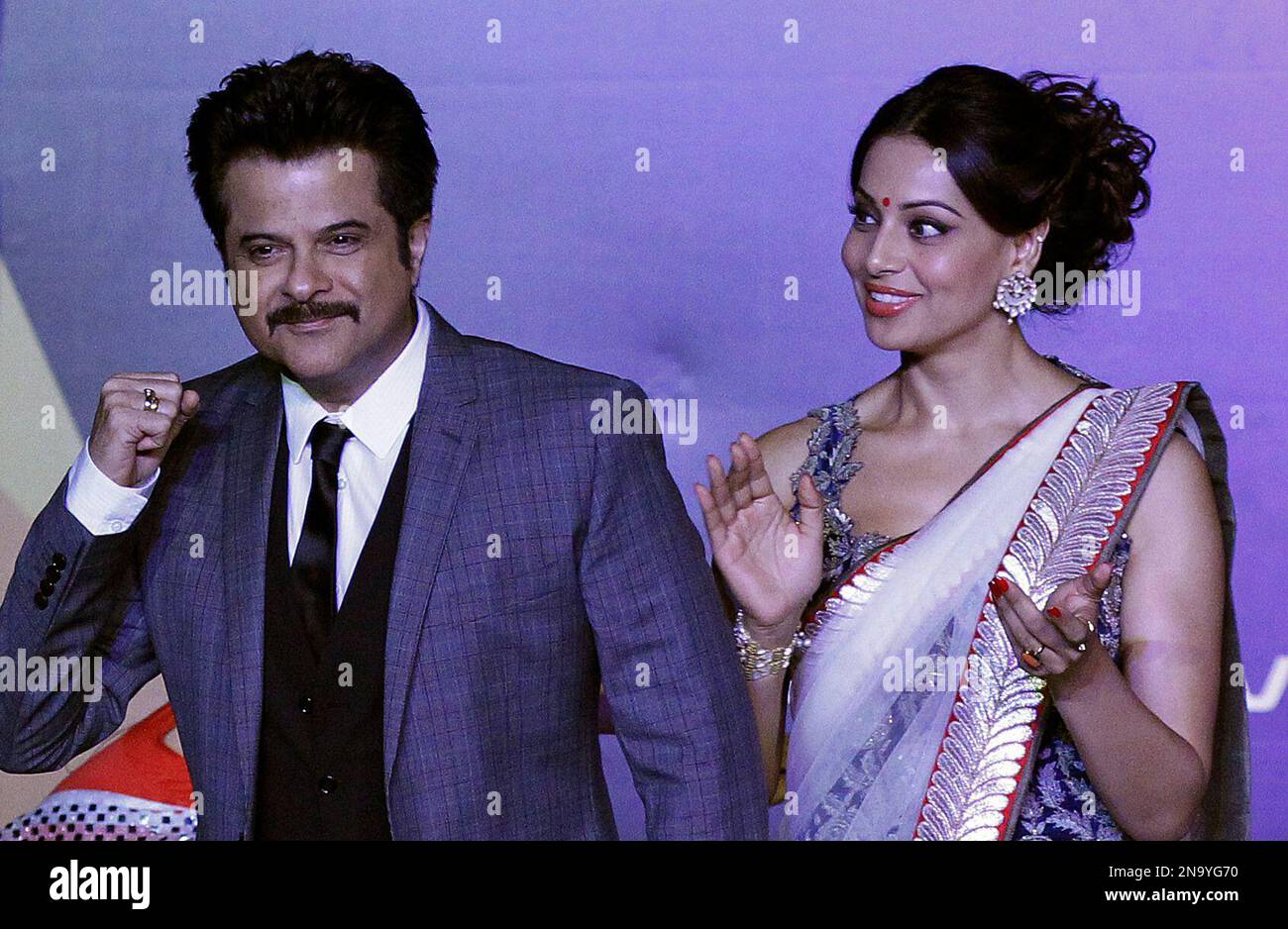 Bollywood actors Anil Kapoor, left, and Bipasha Basu, right, dance as ...