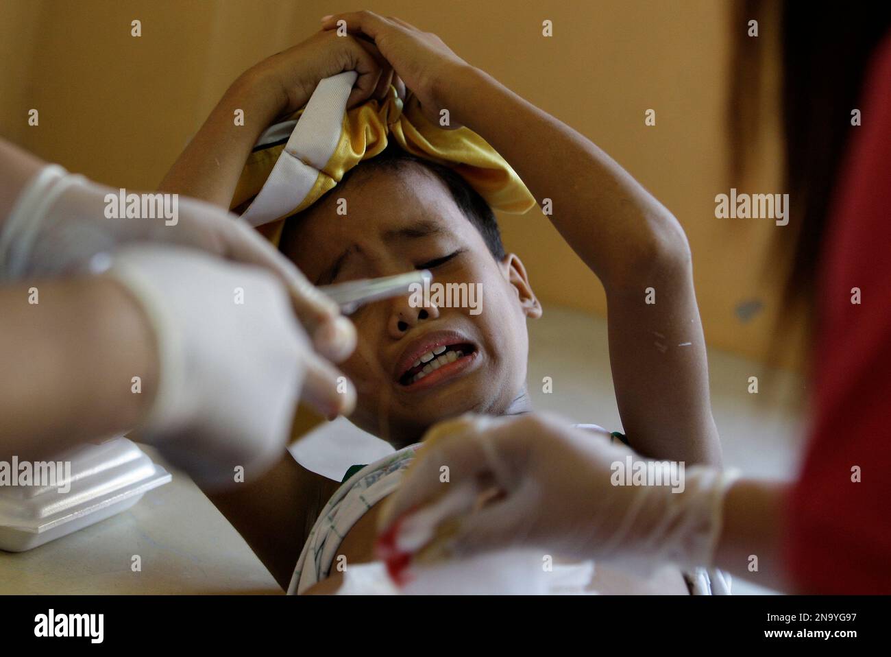 A Filipino boy cries as military doctors perform free circumcision ...