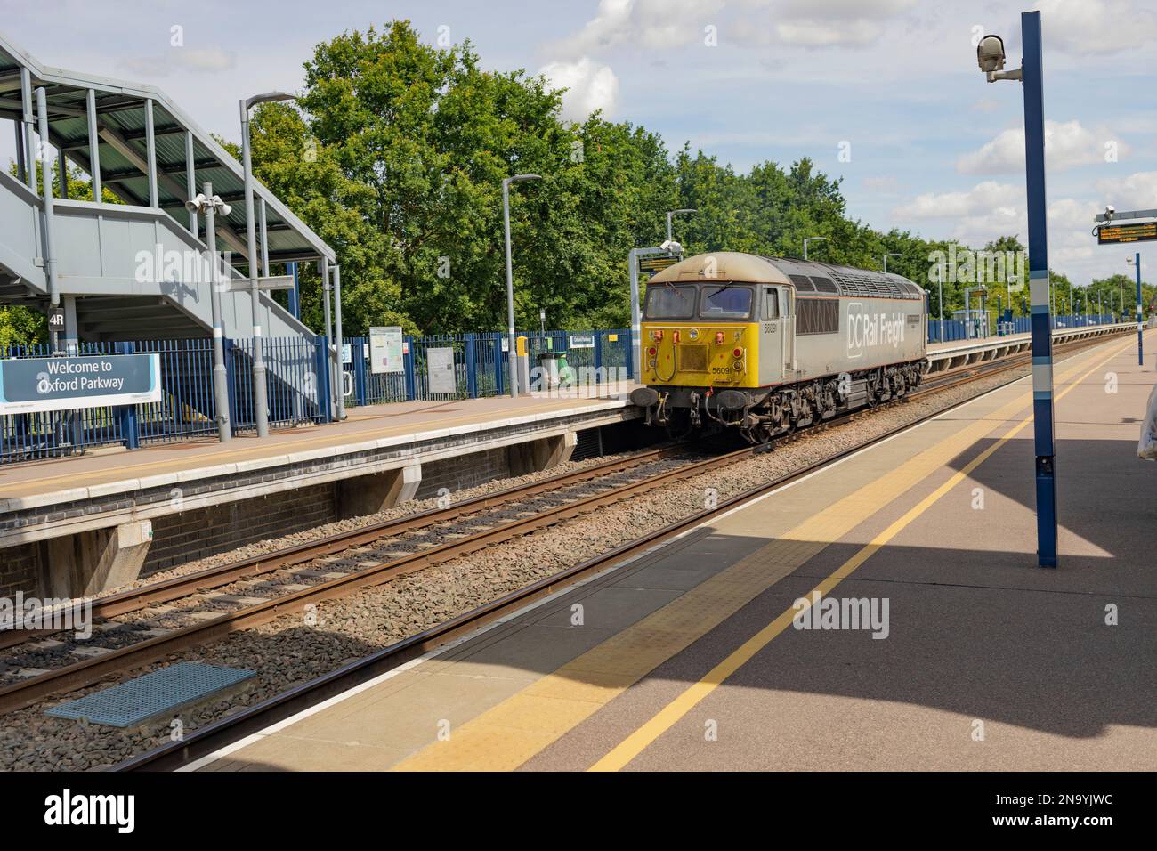 Passenger train on the tracks at a station in the UK; Oxford, England ...