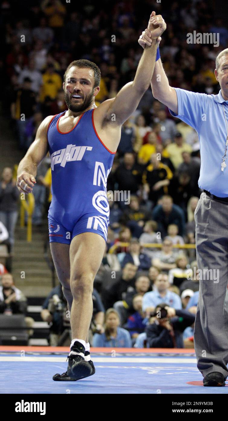 Jared Frayer celebrates after beating Brent Metcalf in the 66-kilogram ...
