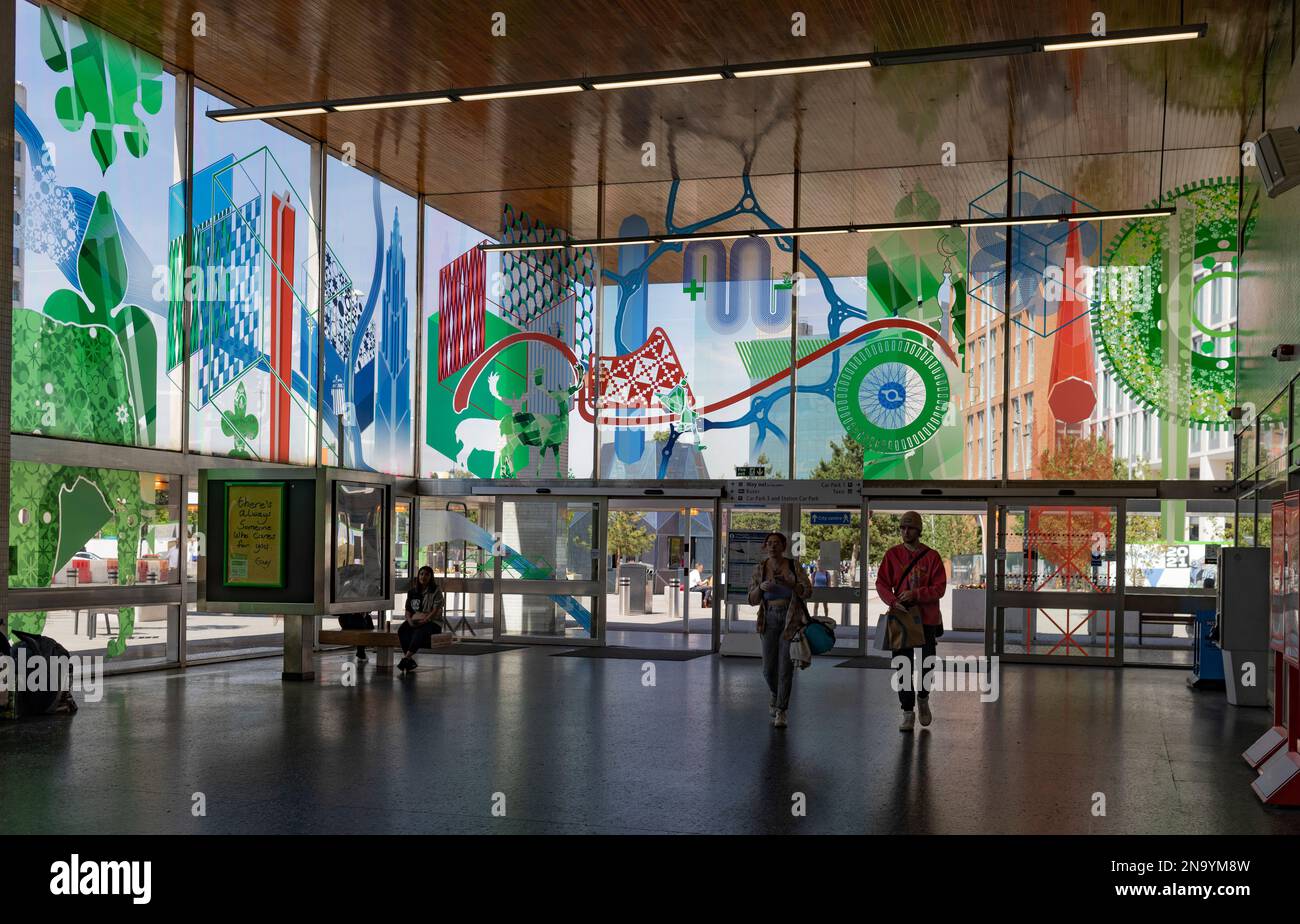 Colourful decals decorate large windows of a commercial building ...