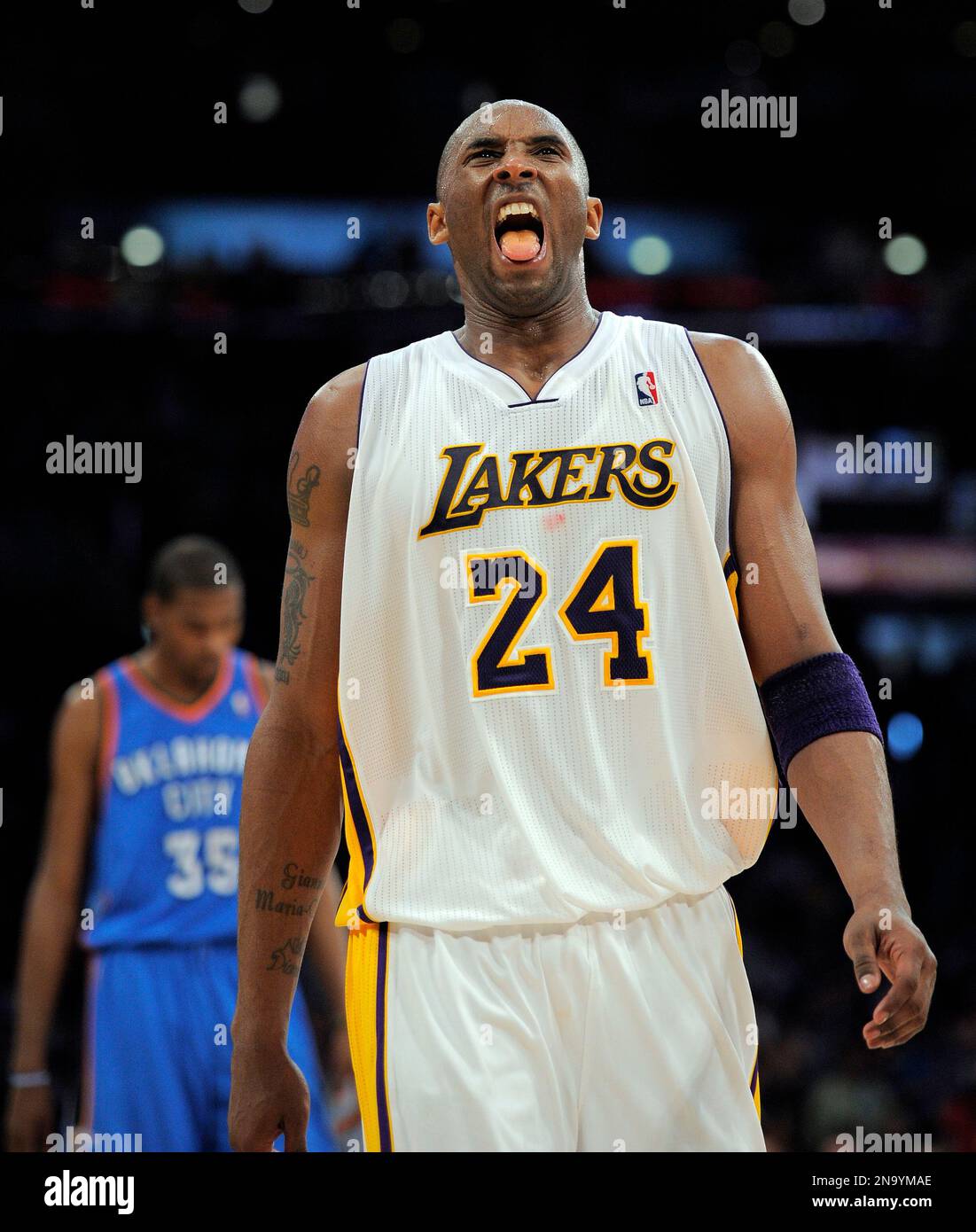 Los Angeles Lakers guard Kobe Bryant, right, reacts as Oklahoma City ...