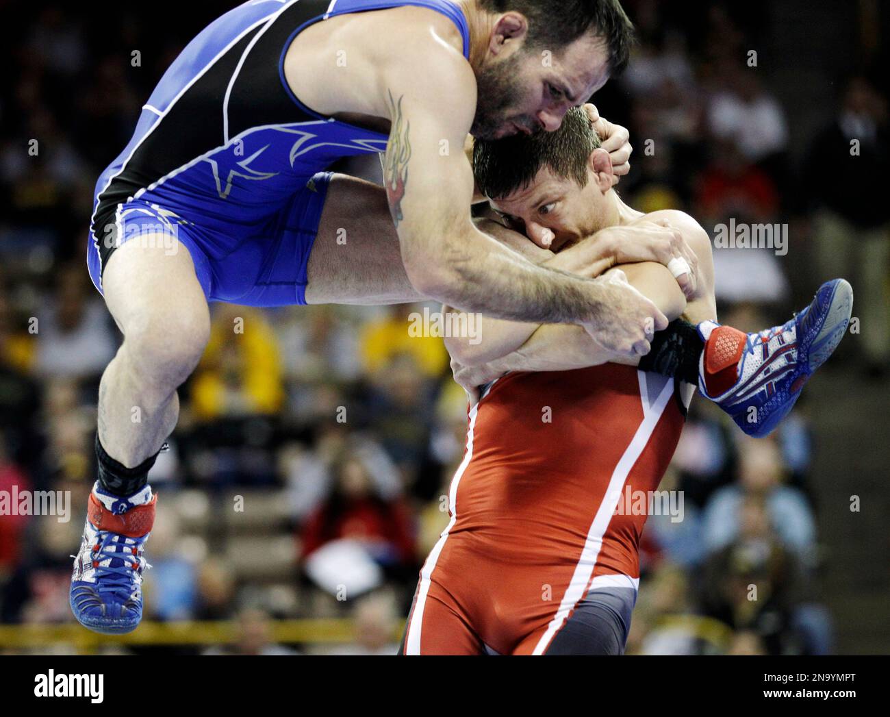 Mark McKnight, right, lifts Danny Felix off the mat during their 55 ...