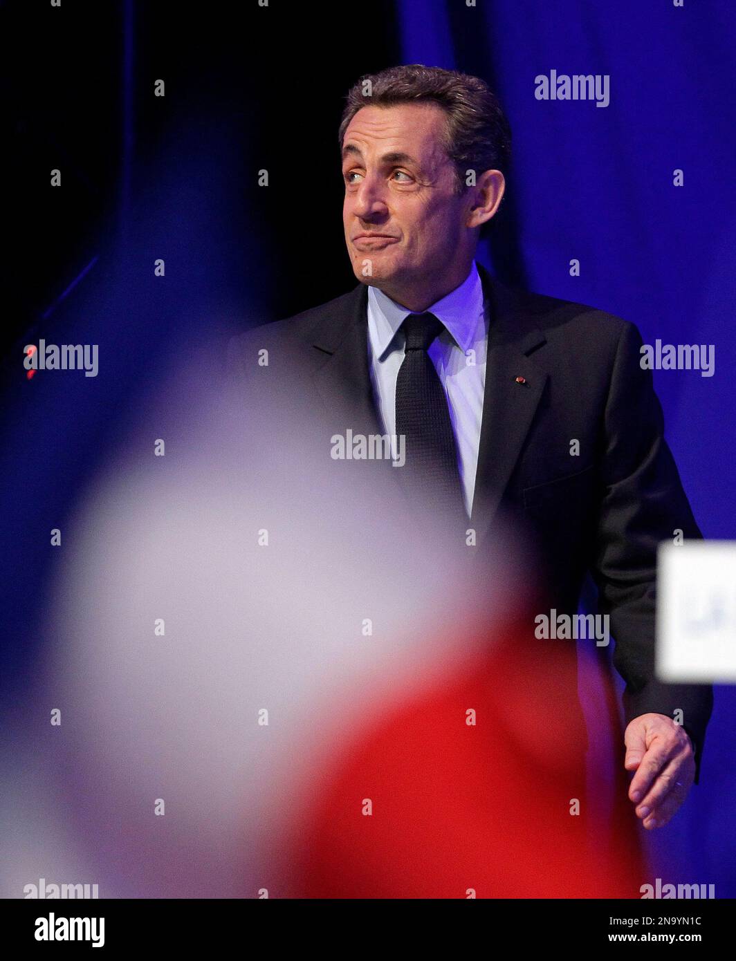 French President and UMP candidate Nicolas Sarkozy walks on stage to ...