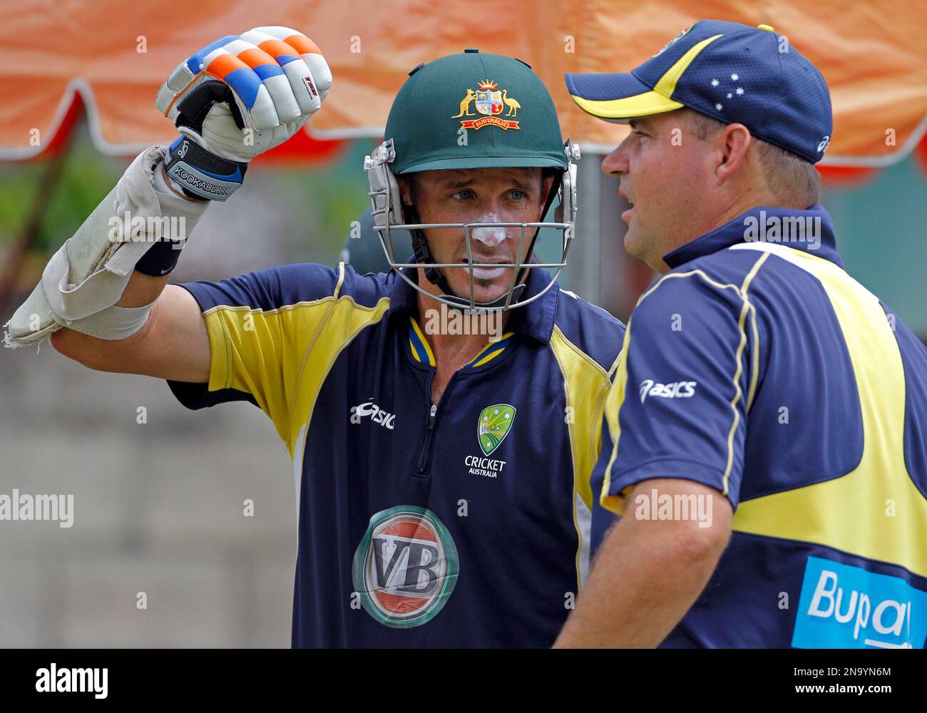 Australia's Mike Hussey, left, speaks to his coach Mickey Arthur during ...