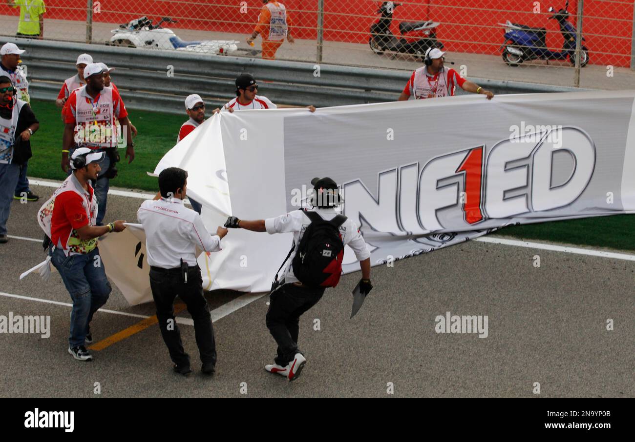 Marshals celebrate after the Bahrain Formula One Grand Prix at the ...