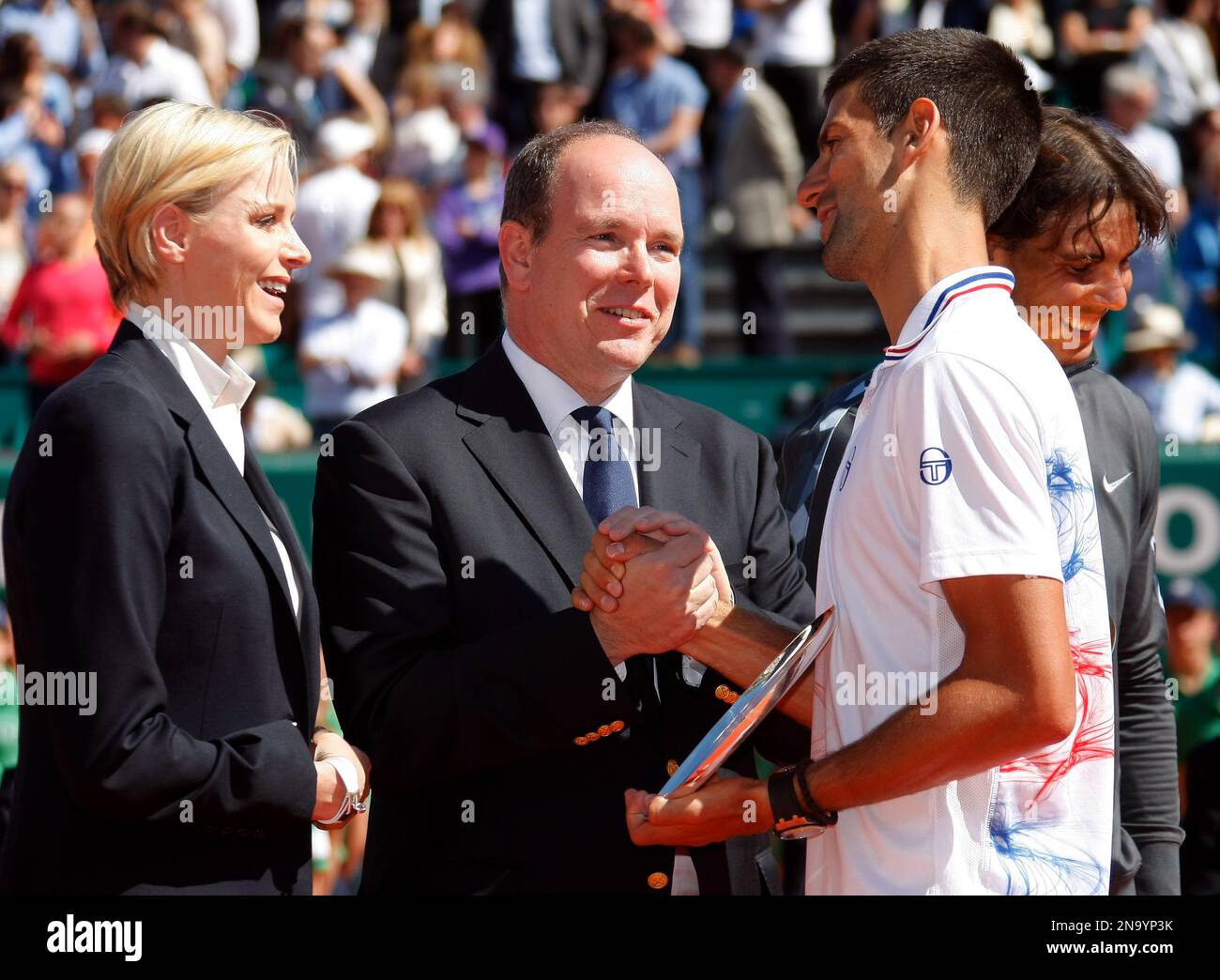 Prince Albert II of Monaco, second left, and his wife Princess Charlene ...