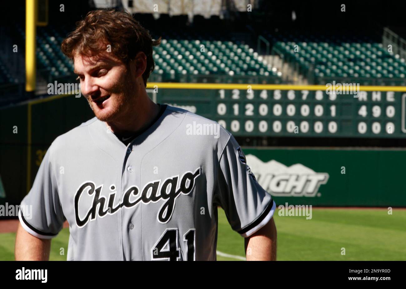 Chicago White Sox starting pitcher Phil Humber briefly stops in view of ...